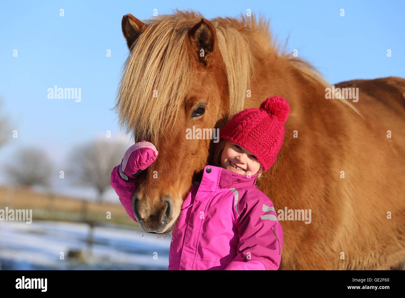 Girl cuddling pony hi-res stock photography and images - Alamy