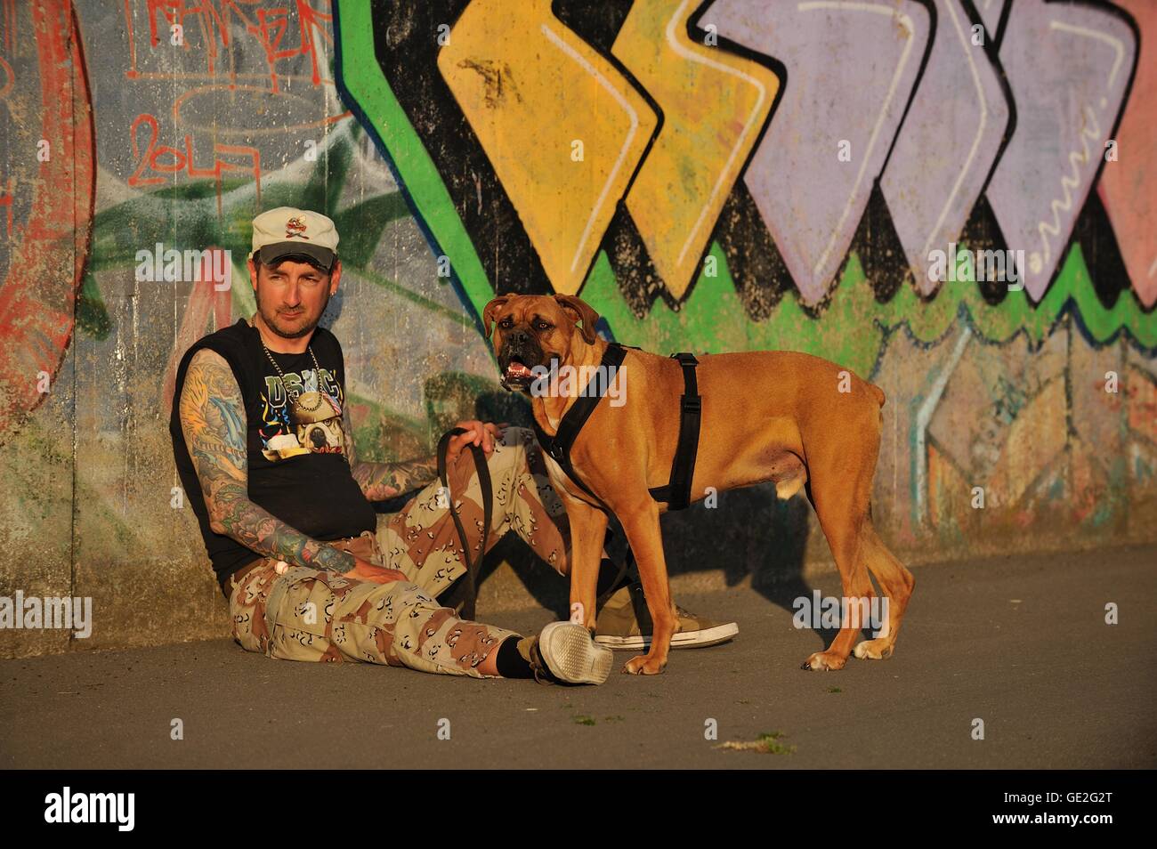 man and German Boxer Stock Photo - Alamy