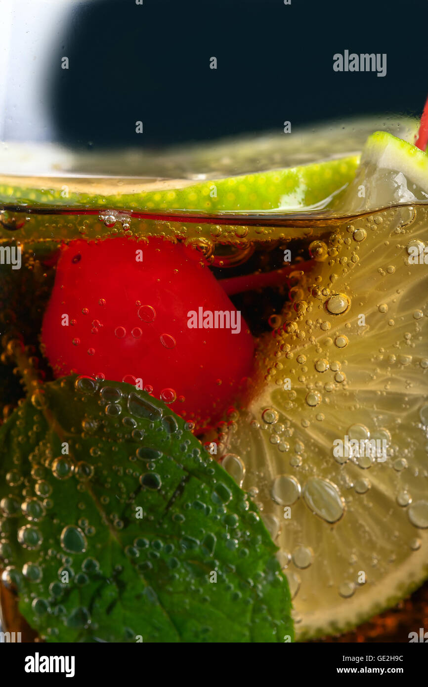 cola with lime , cherry and peppermint leaves Stock Photo - Alamy