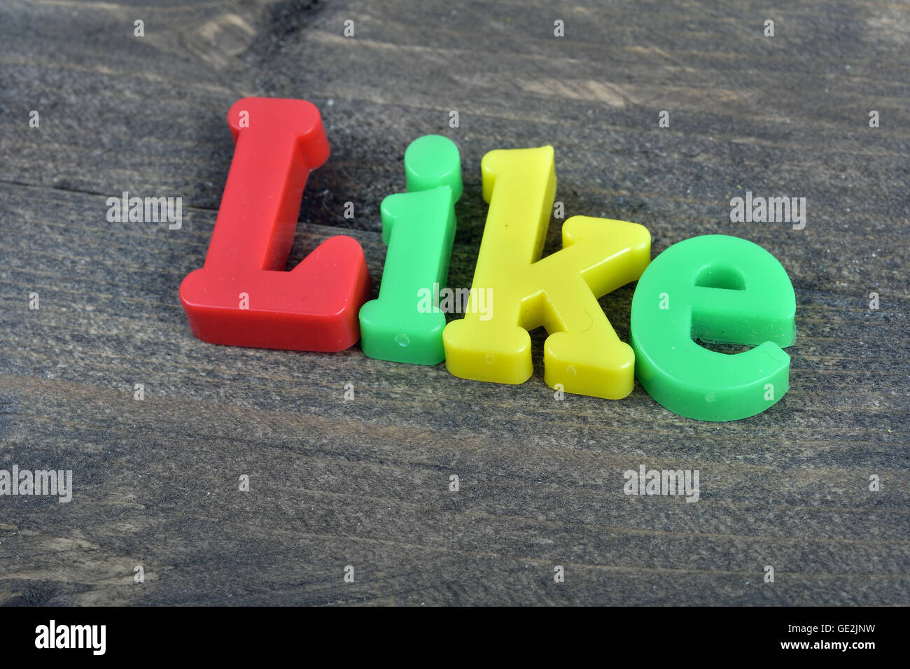 Like word on wooden table Stock Photo - Alamy
