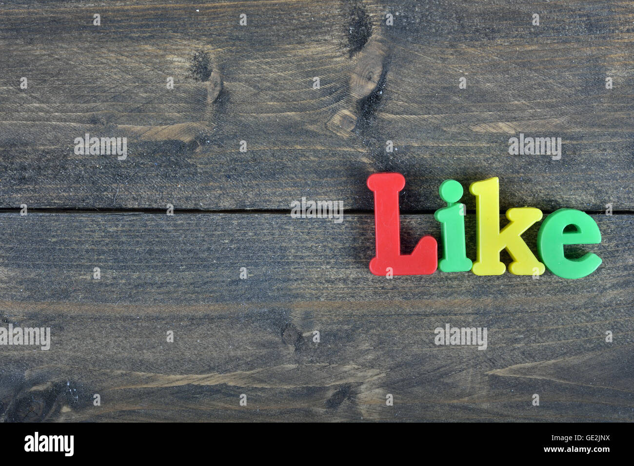 Like word on wooden table Stock Photo - Alamy