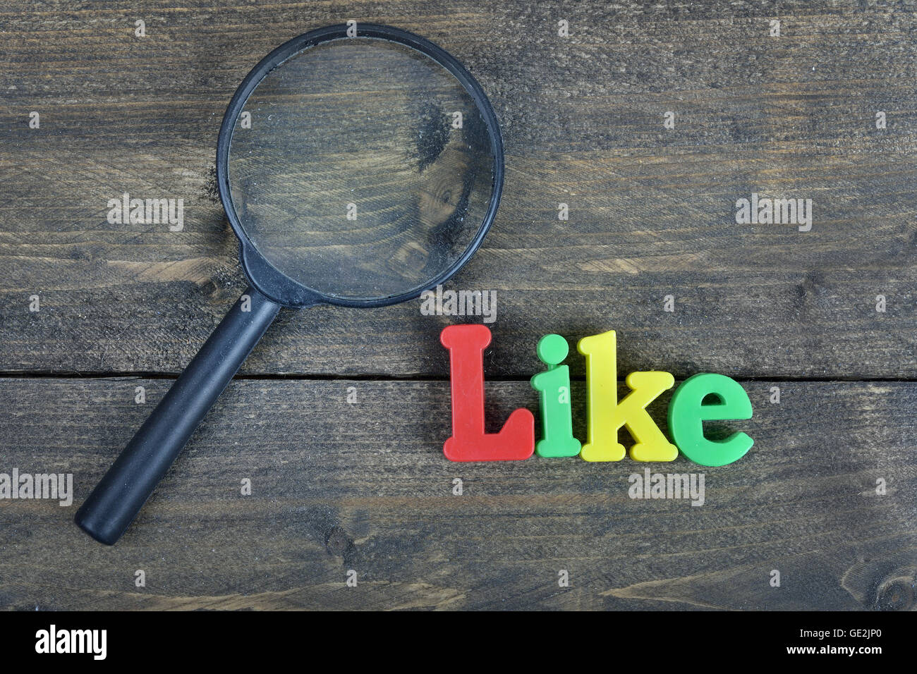 Like word on wooden table Stock Photo - Alamy