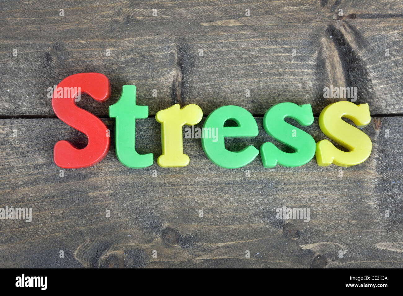 Stress word on wooden table Stock Photo - Alamy