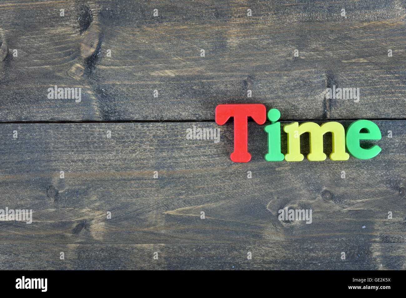 Time word on wooden table Stock Photo - Alamy