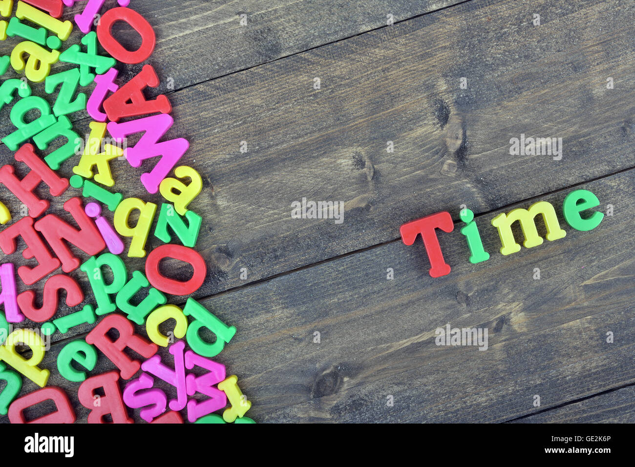 Time word on wooden table Stock Photo - Alamy