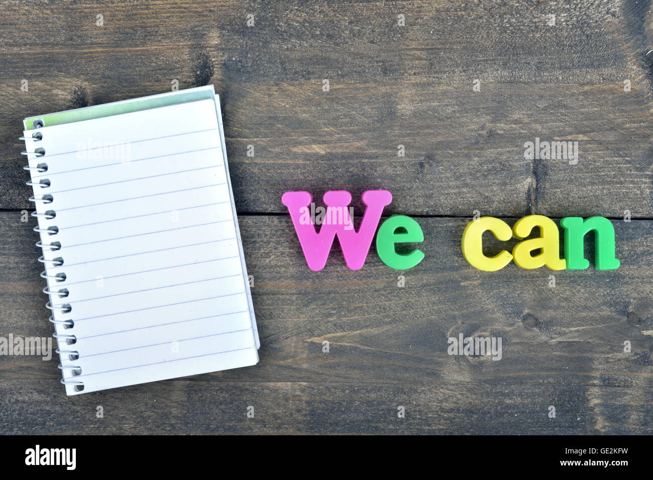 We Can word on wooden table Stock Photo - Alamy