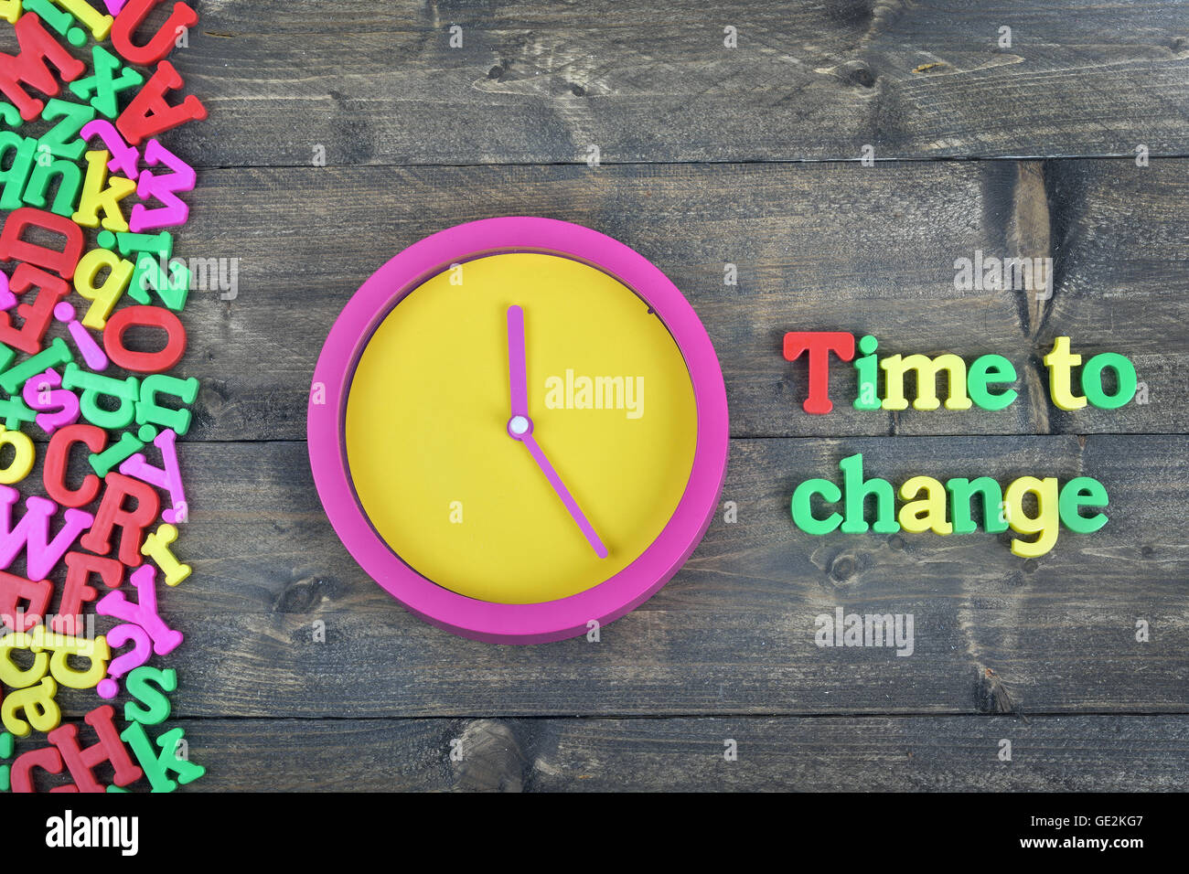 Tine to change word on wooden table Stock Photo - Alamy