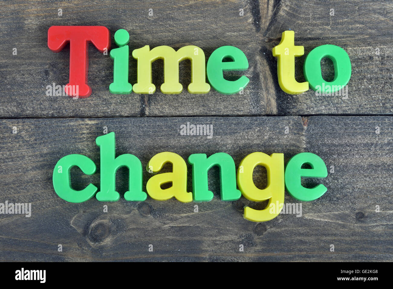 Tine to change word on wooden table Stock Photo - Alamy