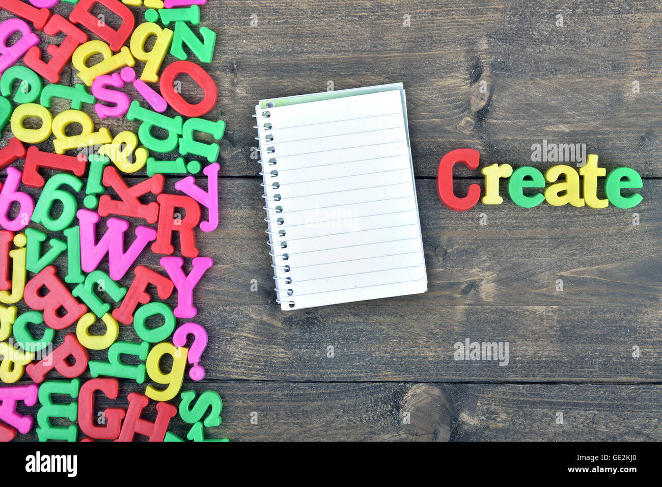 Create word on wooden table Stock Photo - Alamy