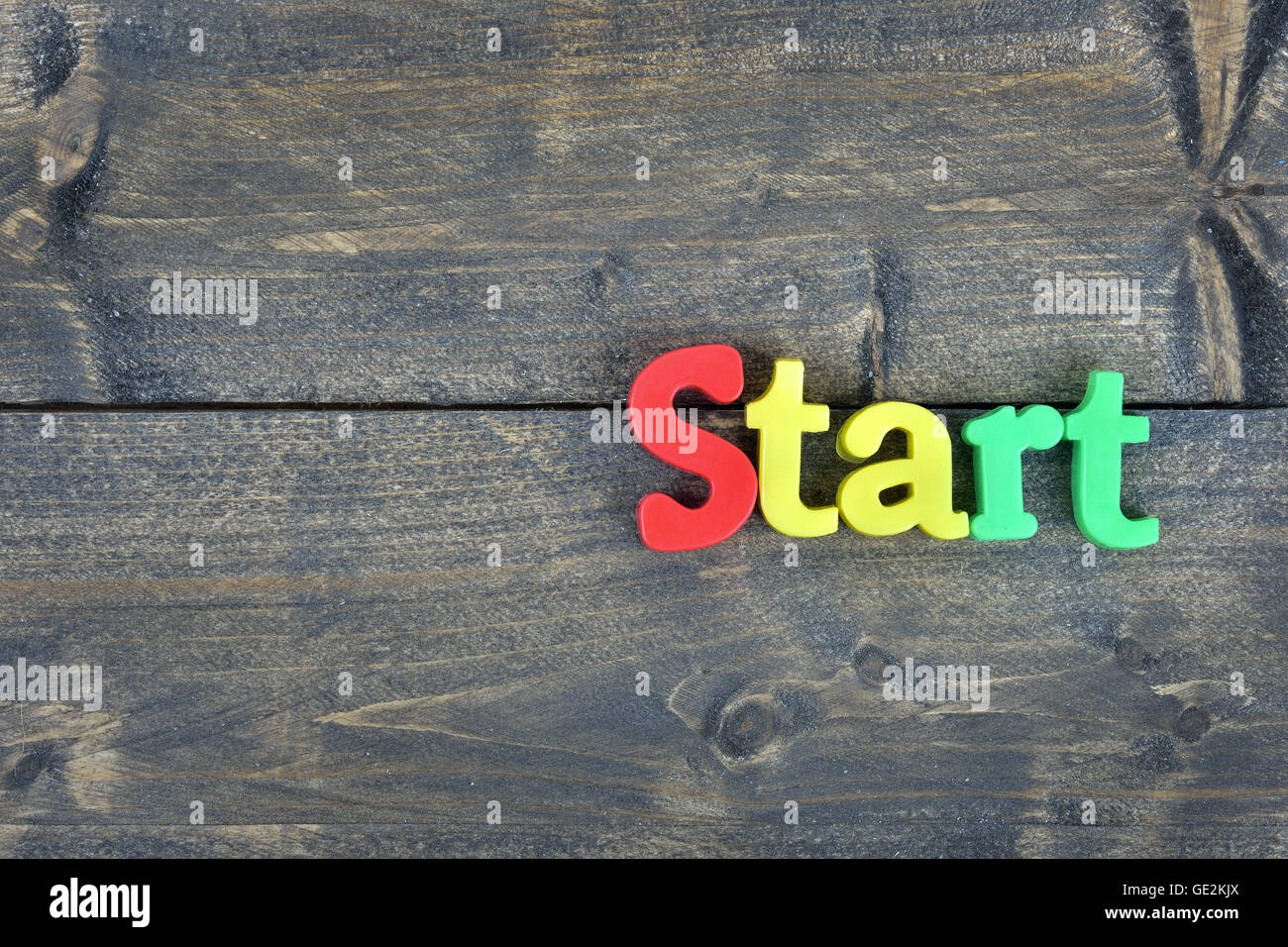 Start word on wooden table Stock Photo - Alamy