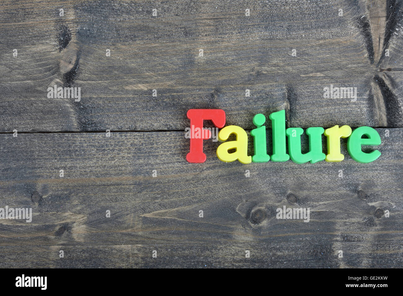 Failure word on wooden table Stock Photo - Alamy