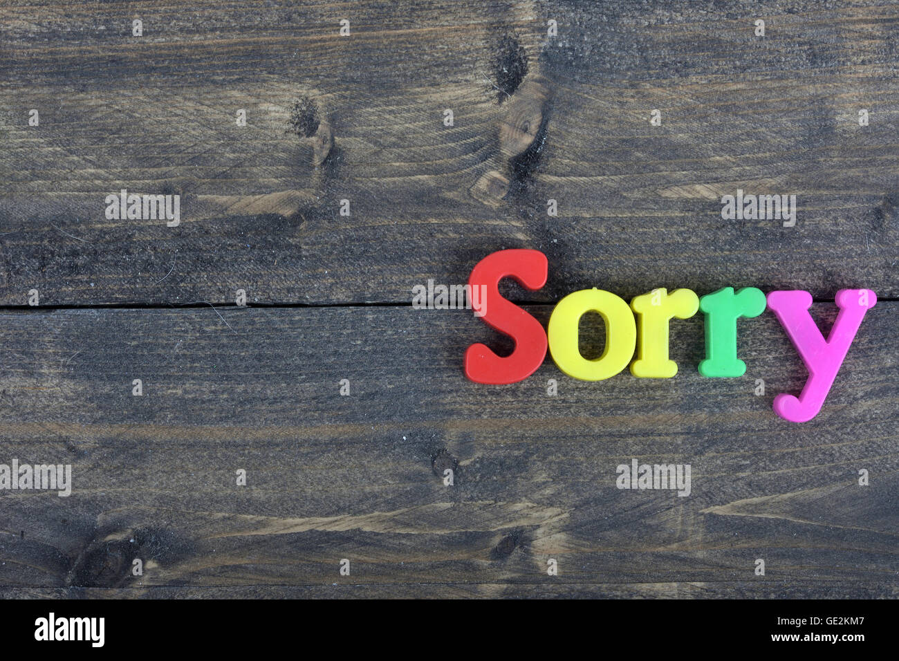 Sorry word on wooden table Stock Photo - Alamy