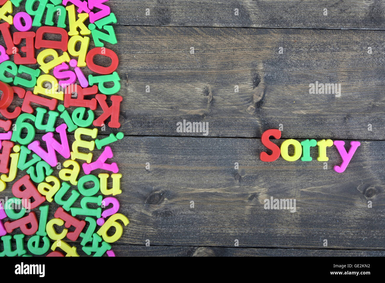 Sorry word on wooden table Stock Photo - Alamy