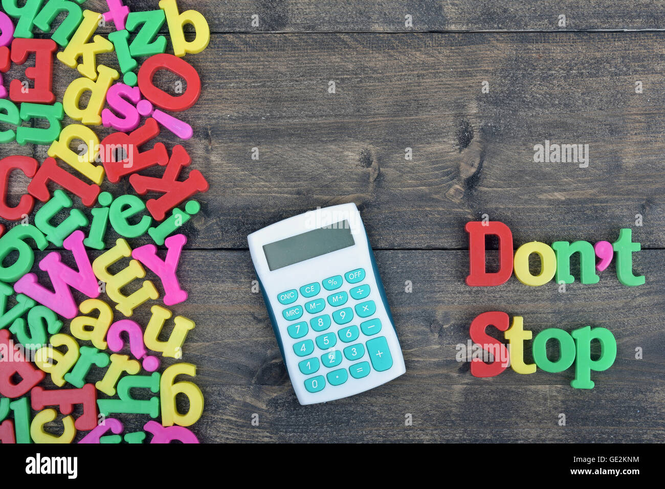 Don't stop word on wooden table Stock Photo - Alamy