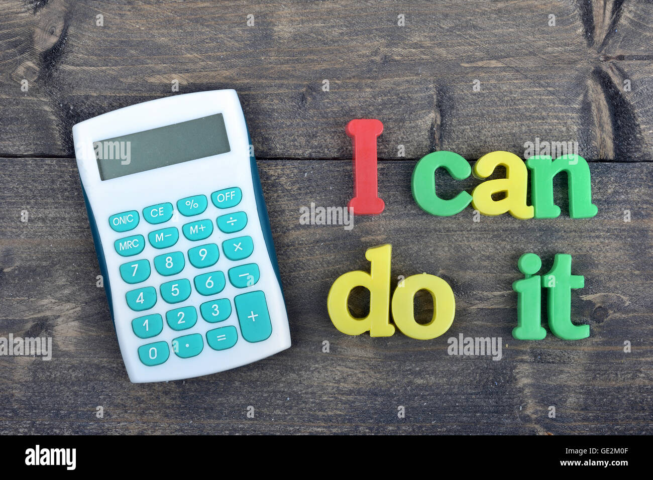 I can do it word on wooden table Stock Photo - Alamy
