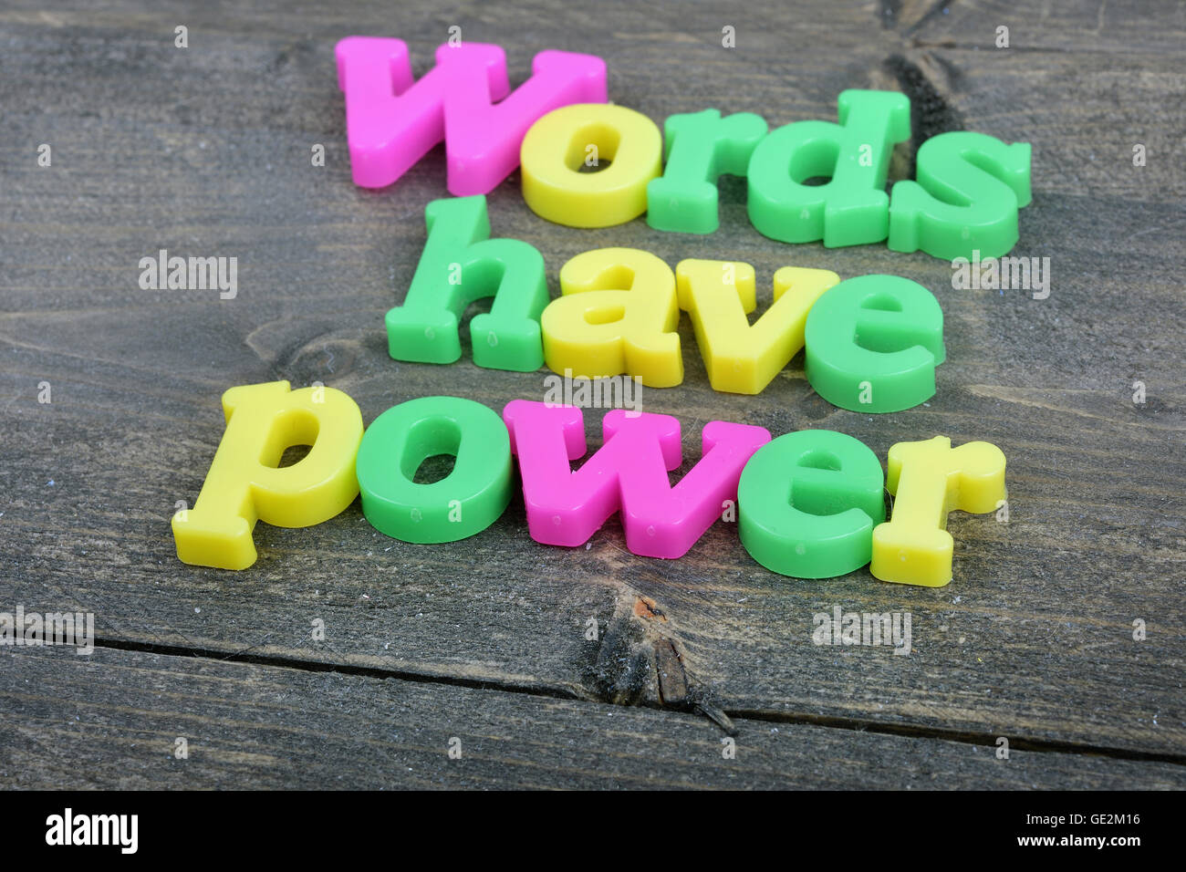 Words have power word on wooden table Stock Photo - Alamy