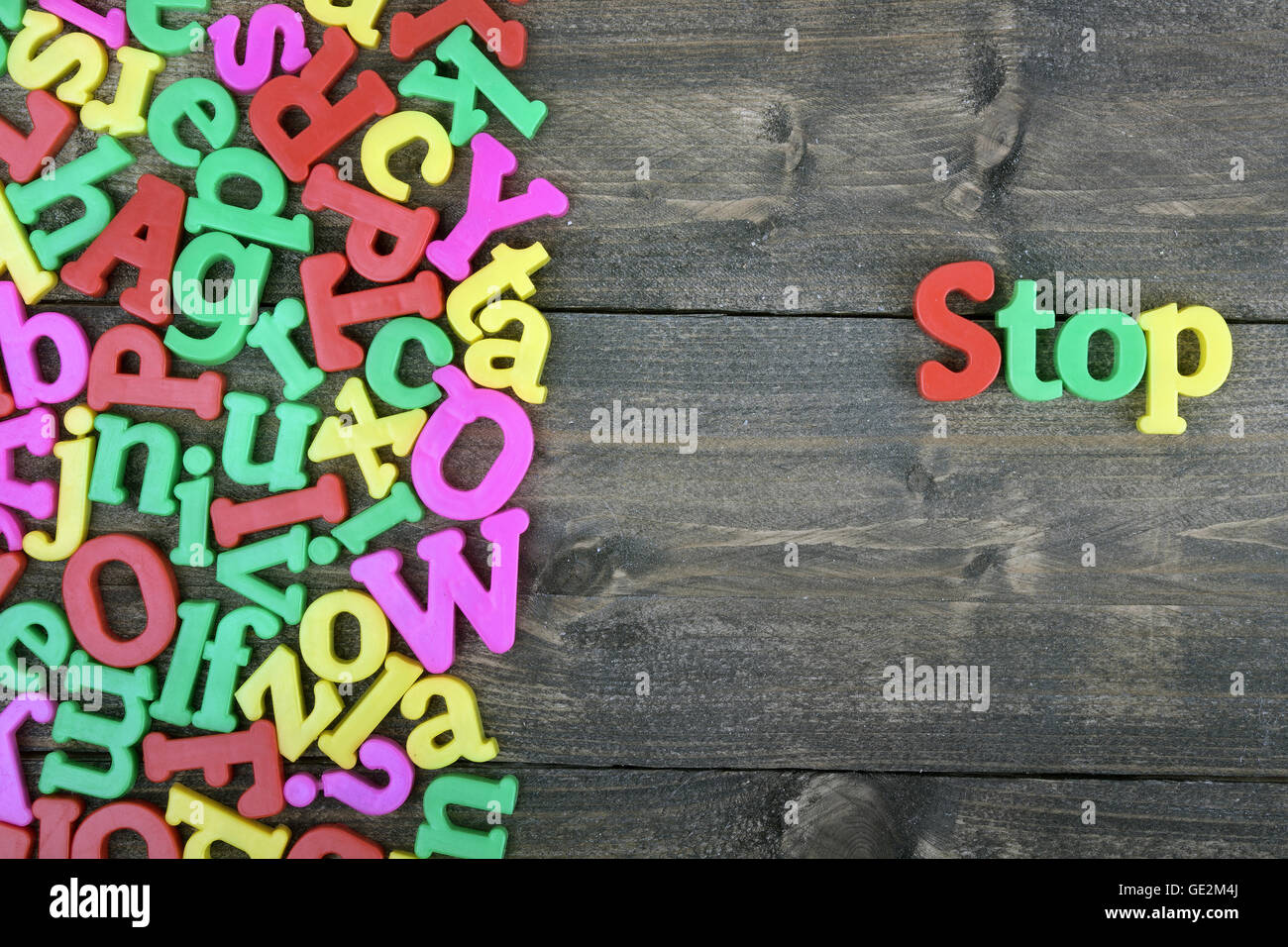Stop word on wooden table Stock Photo - Alamy
