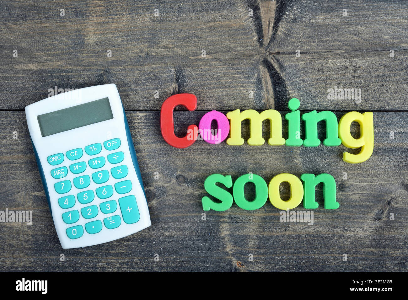 Coming Soon word on wooden table Stock Photo - Alamy