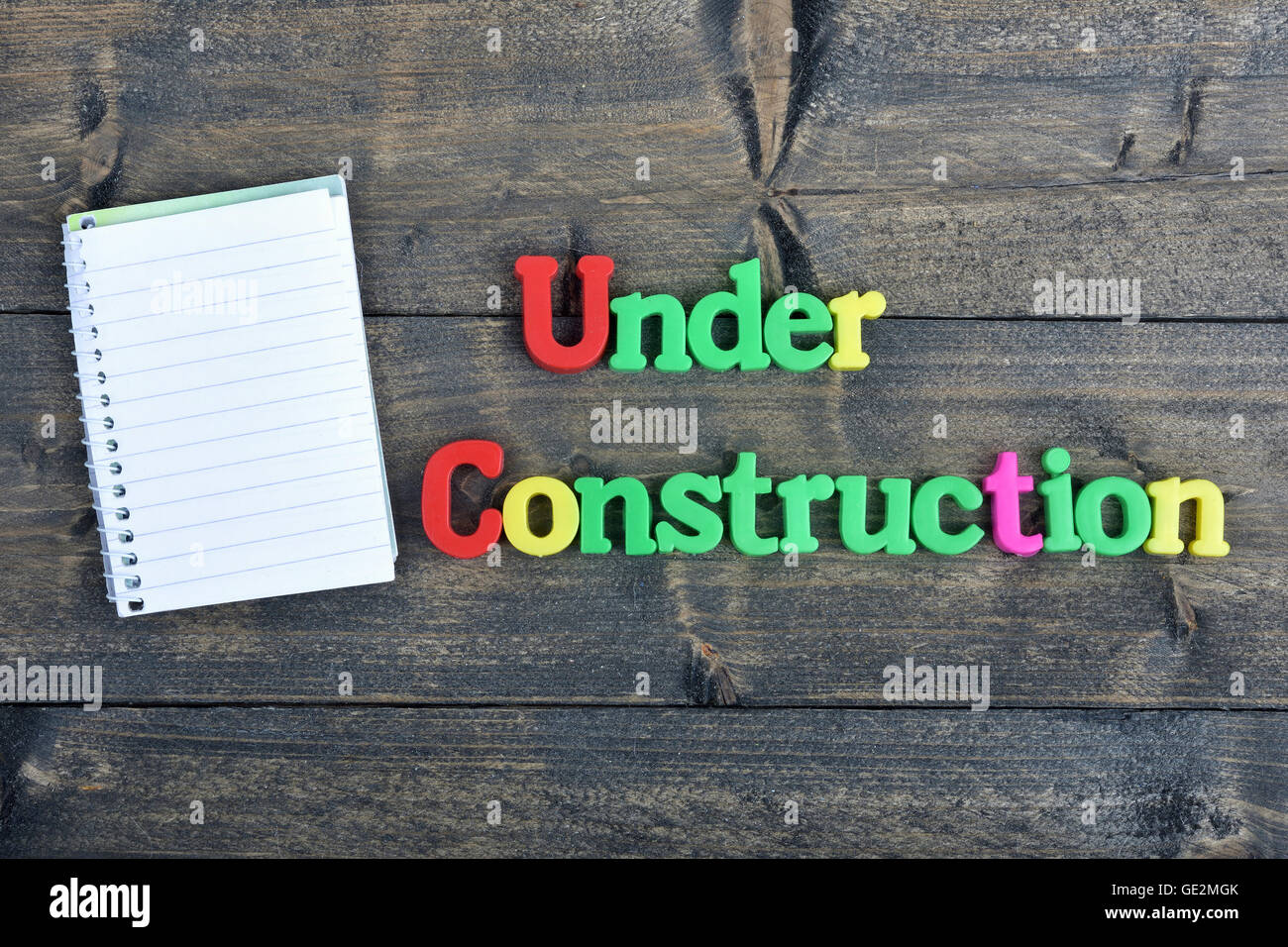 Under Construction word on wooden table Stock Photo - Alamy