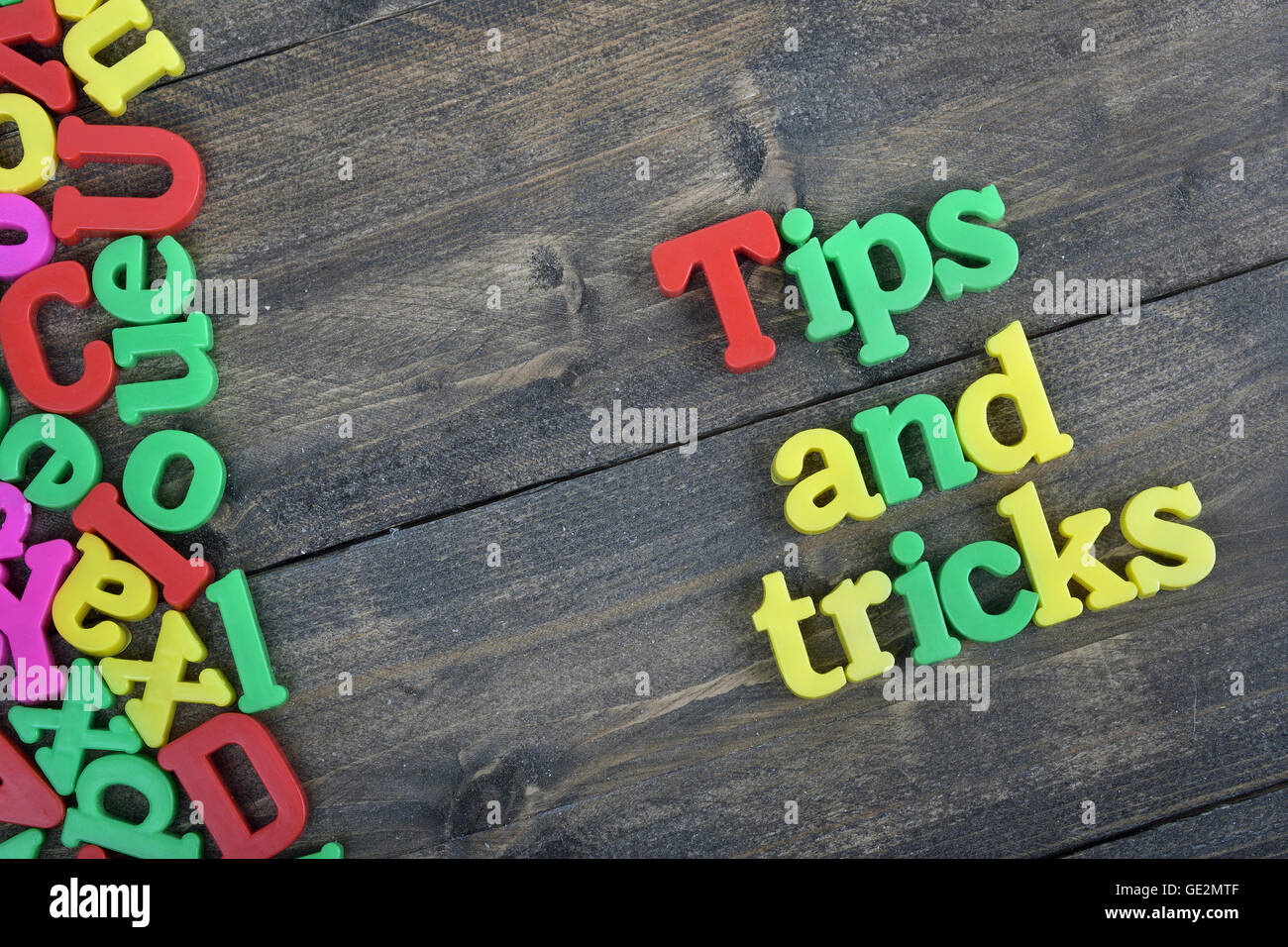 Tips and tricks word on wooden table Stock Photo - Alamy
