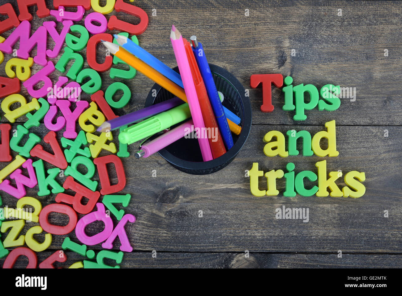 Tips and tricks word on wooden table Stock Photo - Alamy