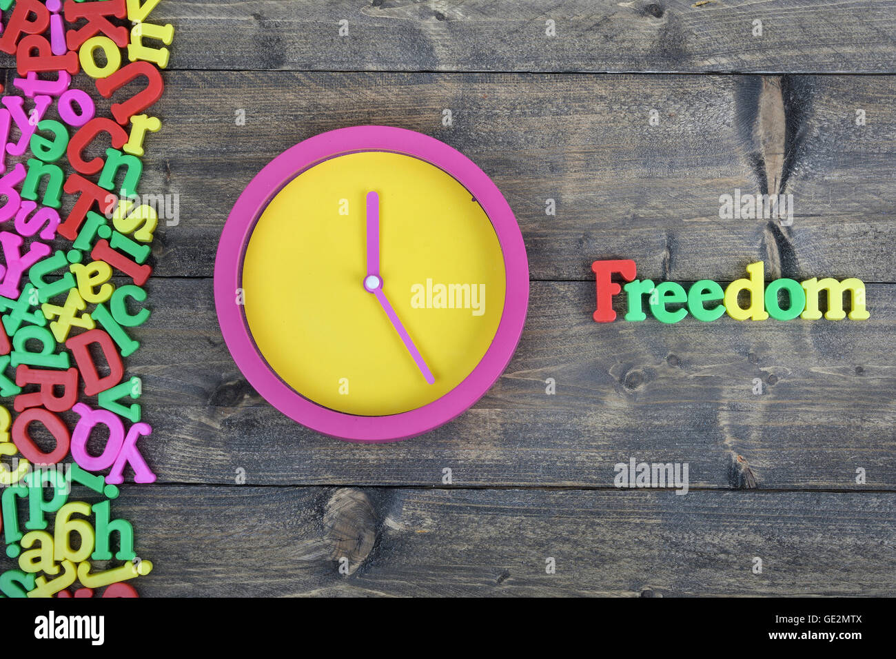 Freedom word on wooden table Stock Photo - Alamy