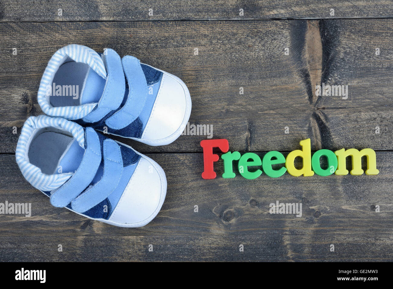 Freedom word on wooden table Stock Photo - Alamy