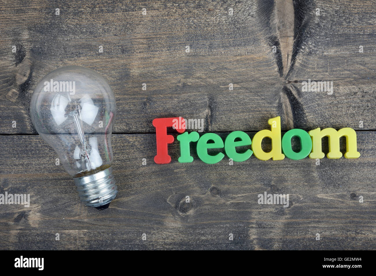 Freedom word on wooden table Stock Photo - Alamy