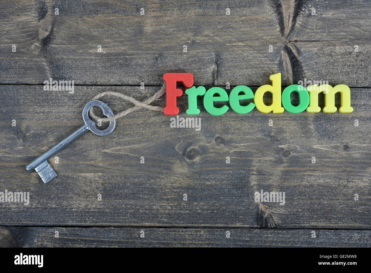 Freedom word on wooden table Stock Photo - Alamy
