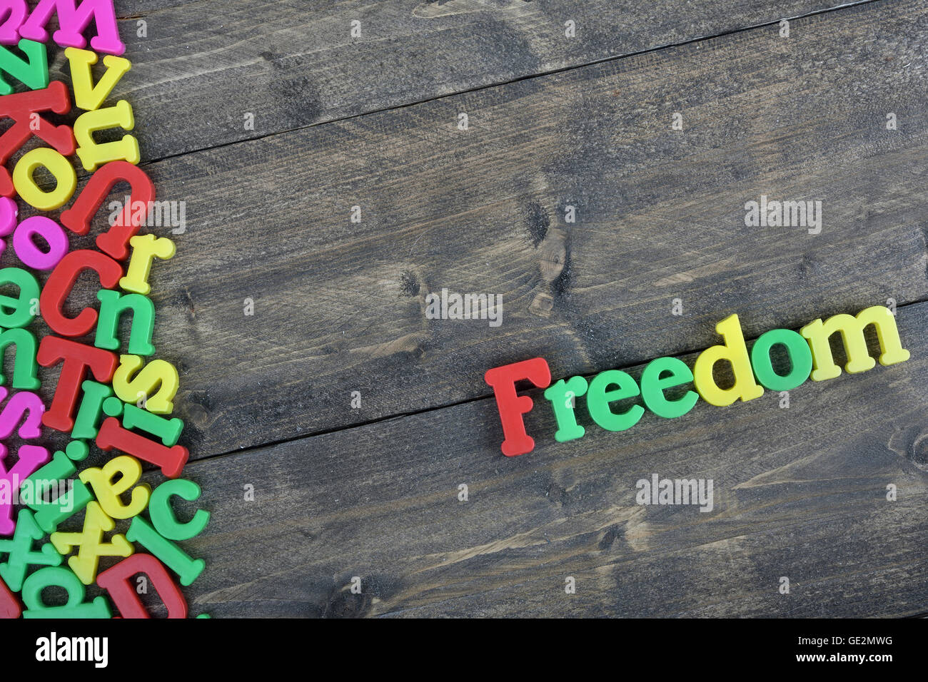 Freedom word on wooden table Stock Photo - Alamy