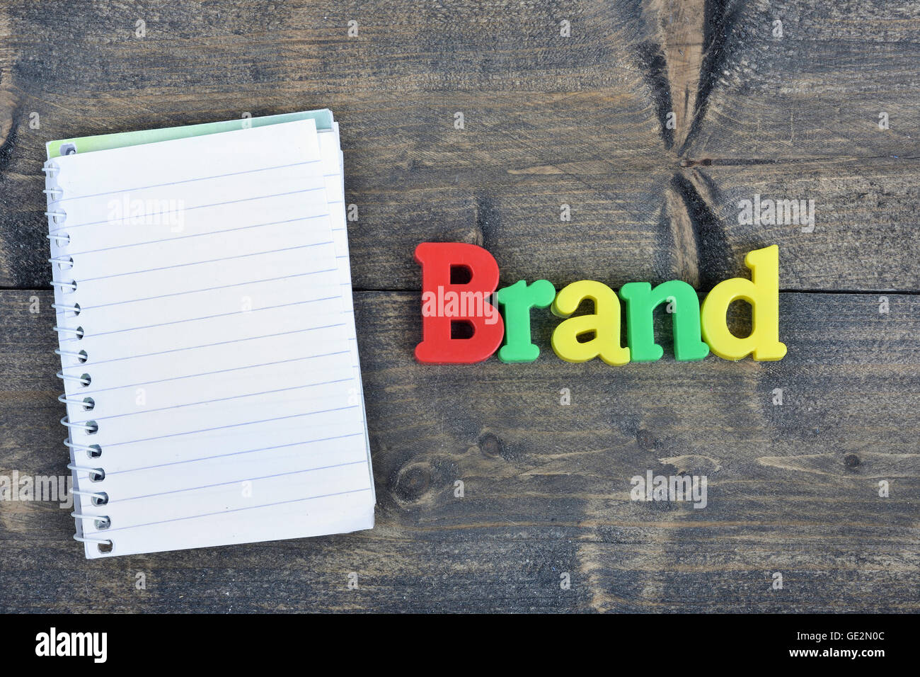 Brand word on wooden table Stock Photo - Alamy