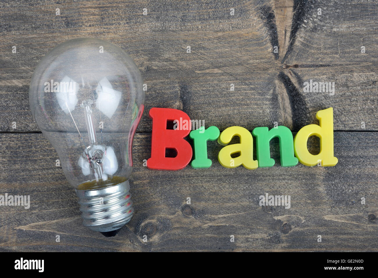 Brand word on wooden table Stock Photo - Alamy