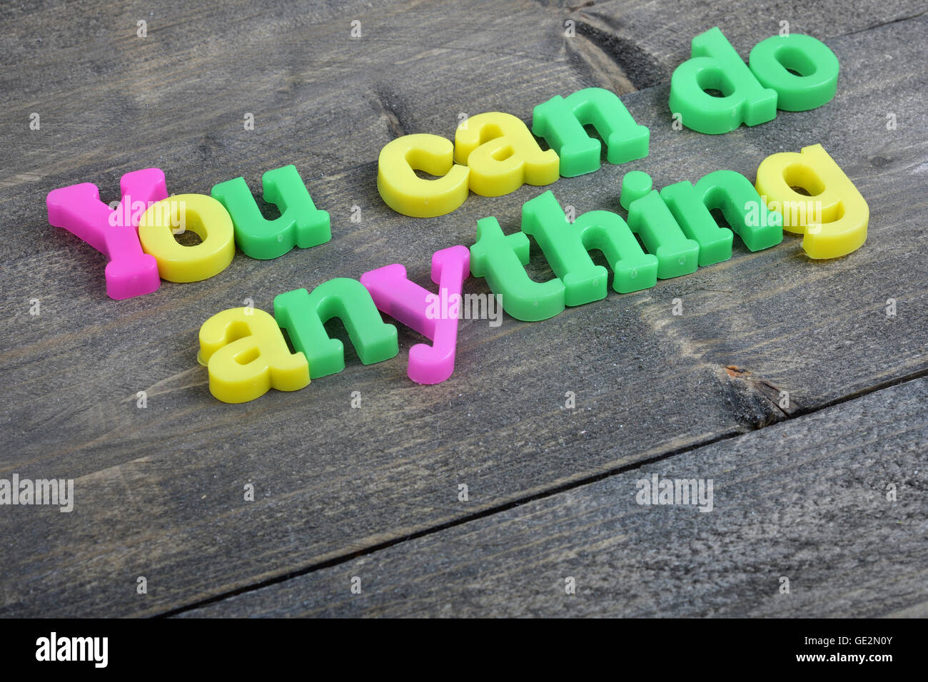 You can do anything word on wooden table Stock Photo - Alamy