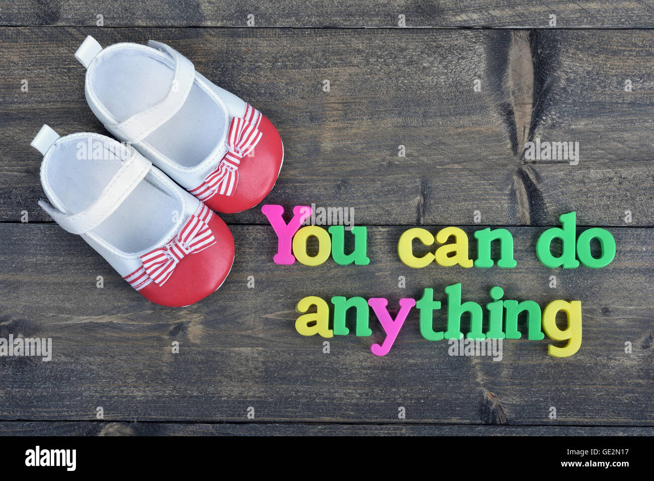 You can do anything word on wooden table Stock Photo - Alamy