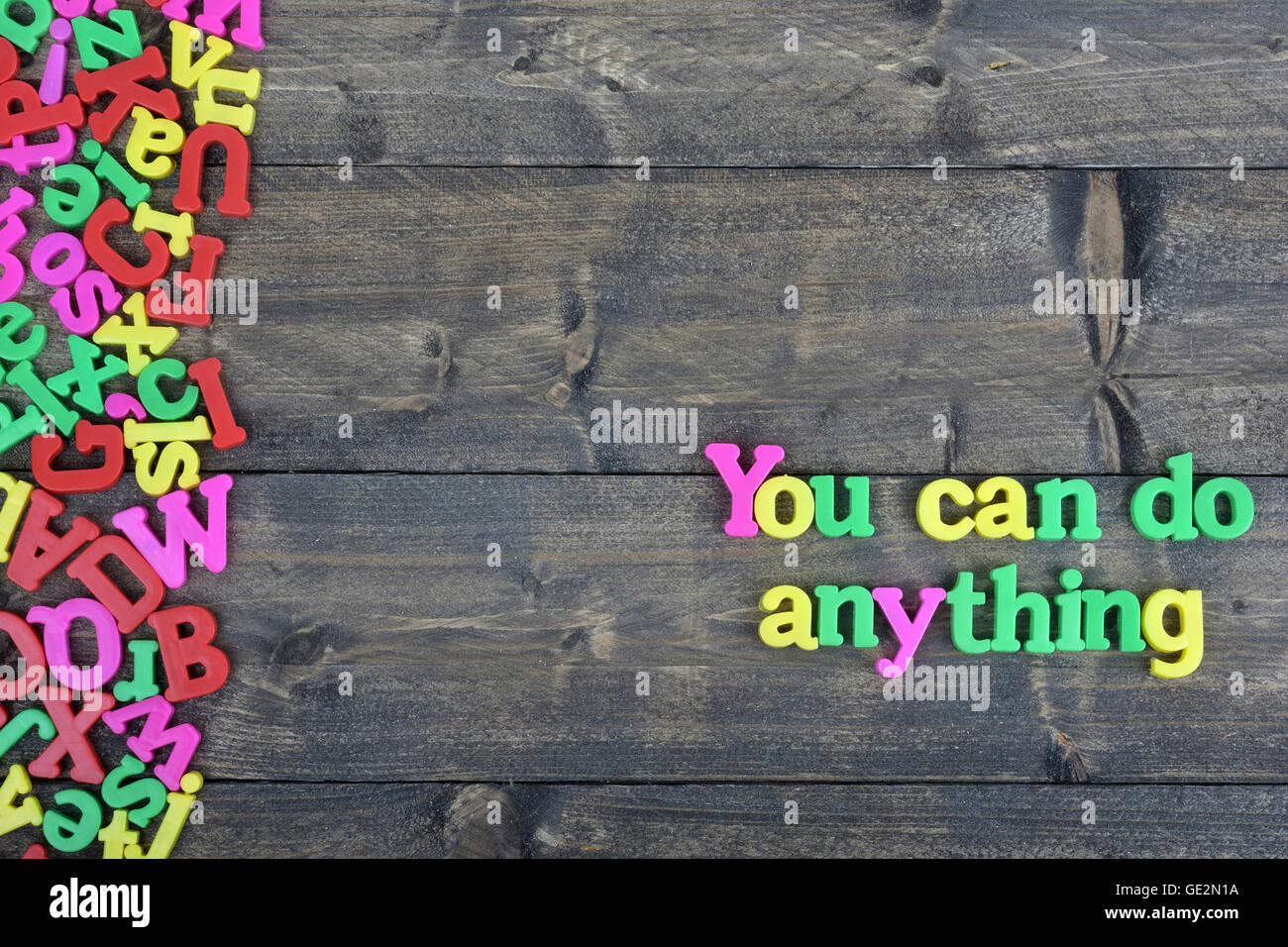 You can do anything word on wooden table Stock Photo - Alamy