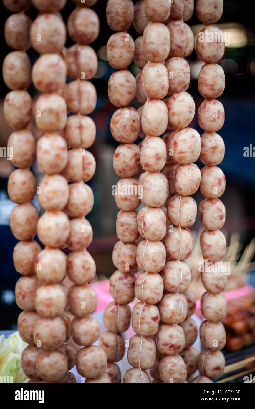 Fresh raw Issan sausage Sai Klok. Traditional thai cuisine Stock Photo ...