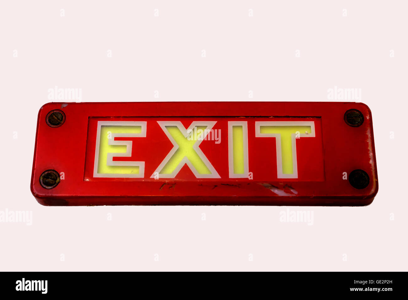 Vintage red metal Exit sign on white wall background with four rusty ...
