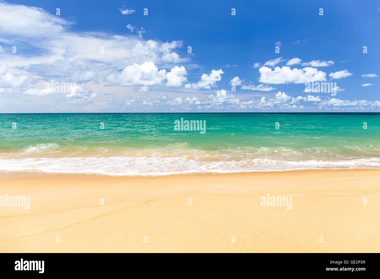 Sandy Beach with blue sky Stock Photo - Alamy
