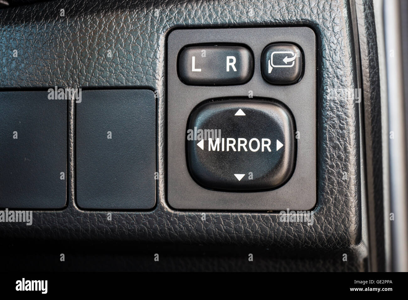 Switch button adjust or controls side mirrors in a car Stock Photo - Alamy Switch button adjust or controls side mirrors in a car Stock Photo - Alamy