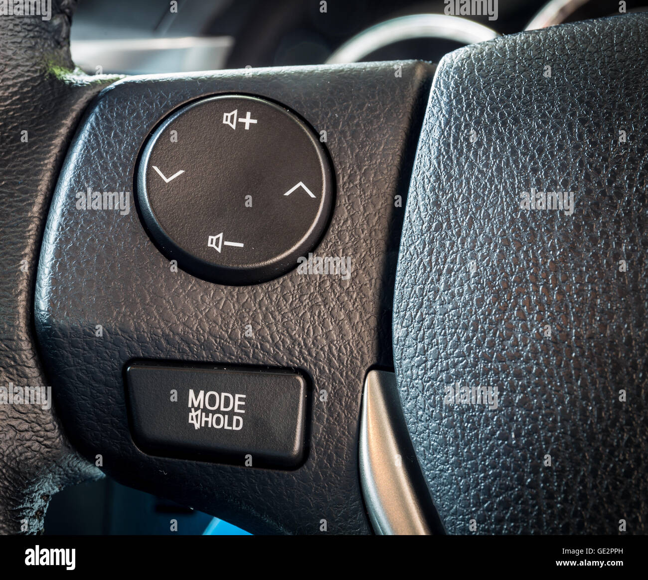 Modern car audio control multifunction buttons on a steering wheel ...