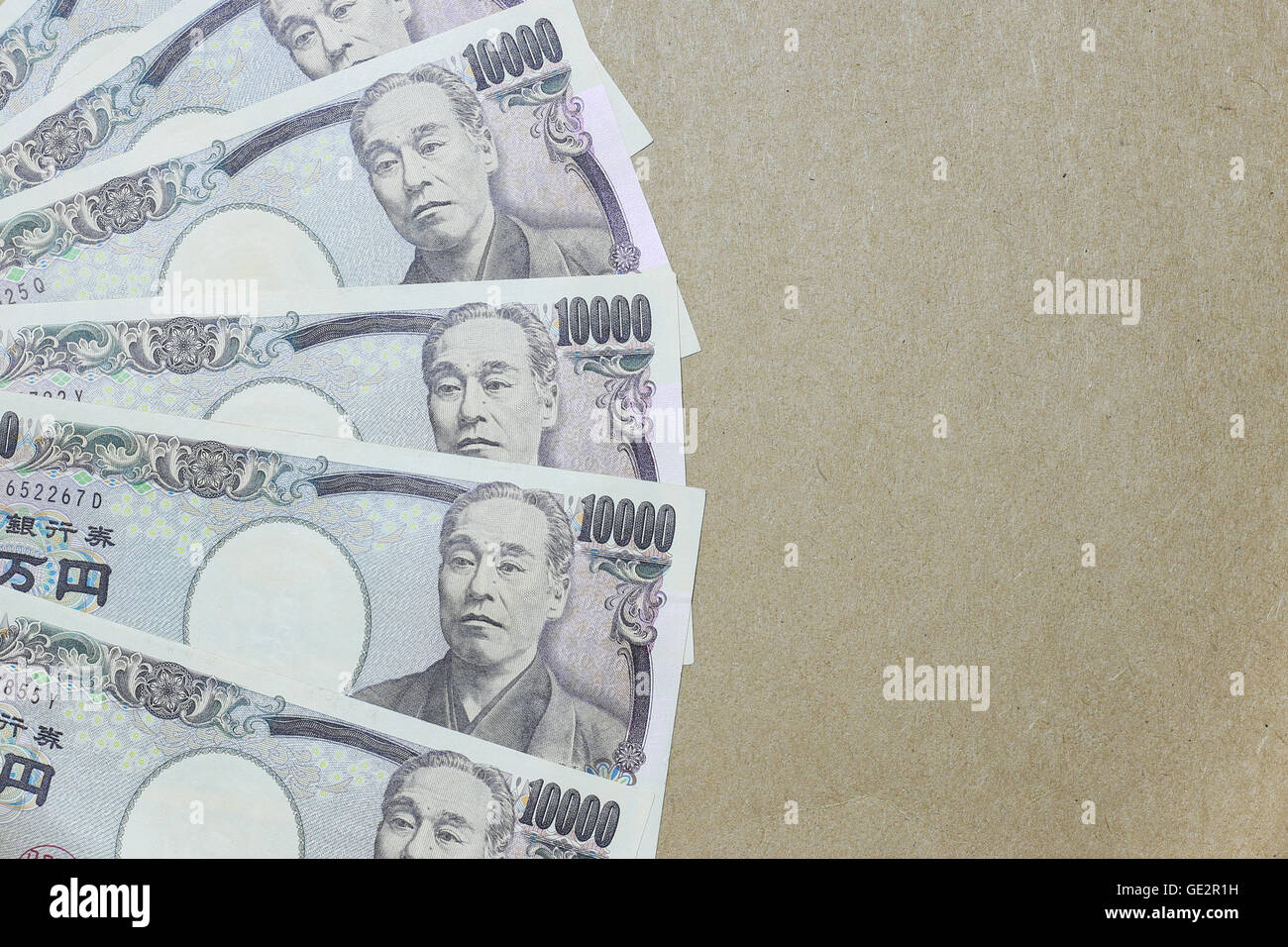 japanese yen on brown paper background Stock Photo - Alamy