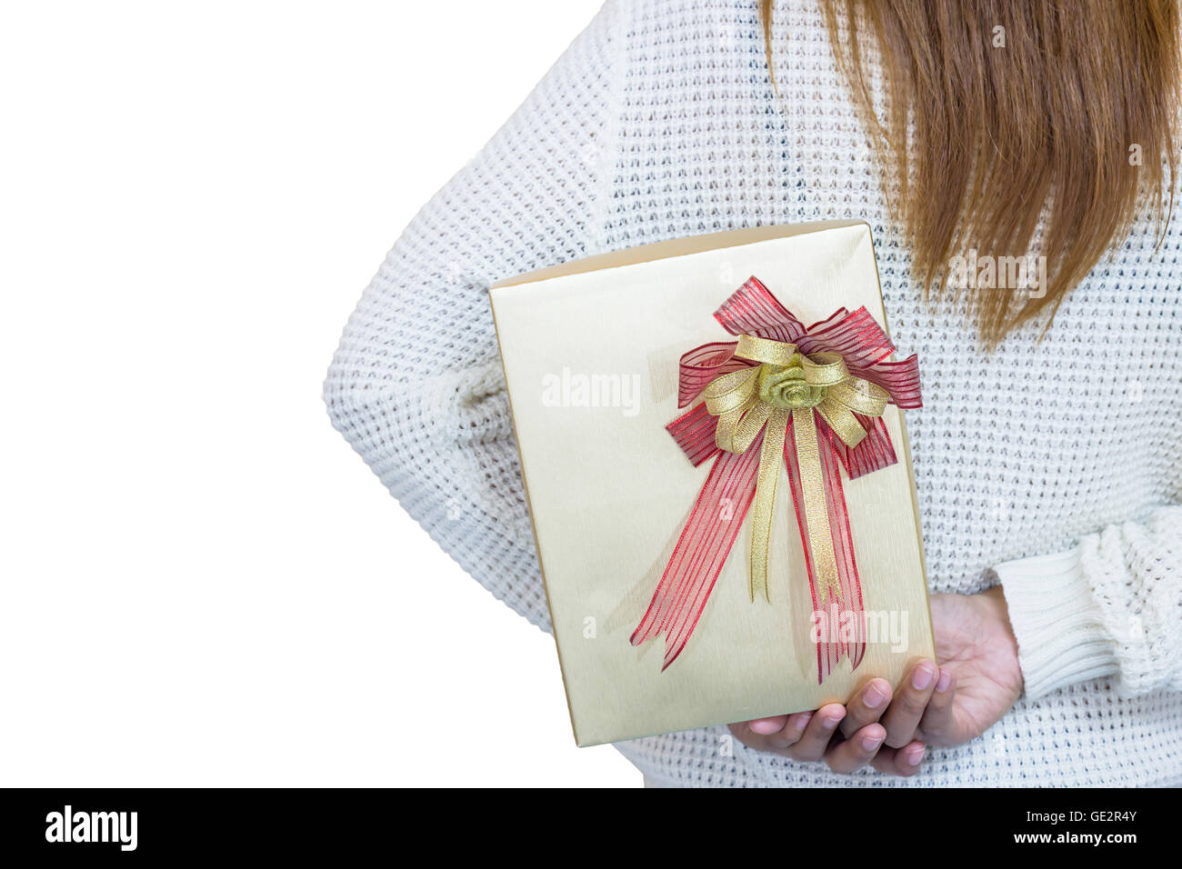 Women in white hiding a gift behind her back on white background Stock ...