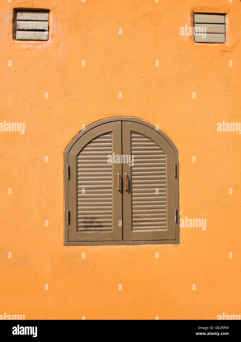 vintage windows on the orange wall Stock Photo - Alamy