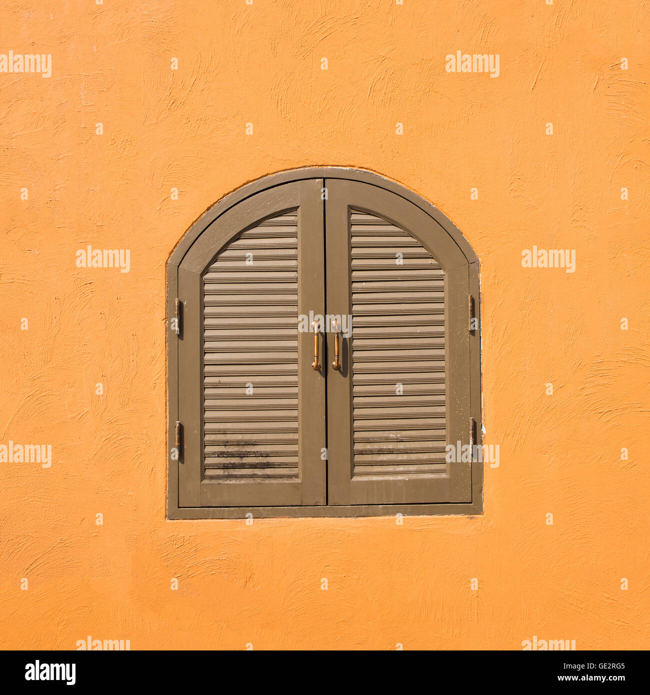 vintage windows on the orange wall Stock Photo - Alamy