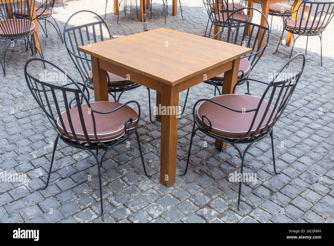 Modern table and chairs set in outdoor Stock Photo - Alamy