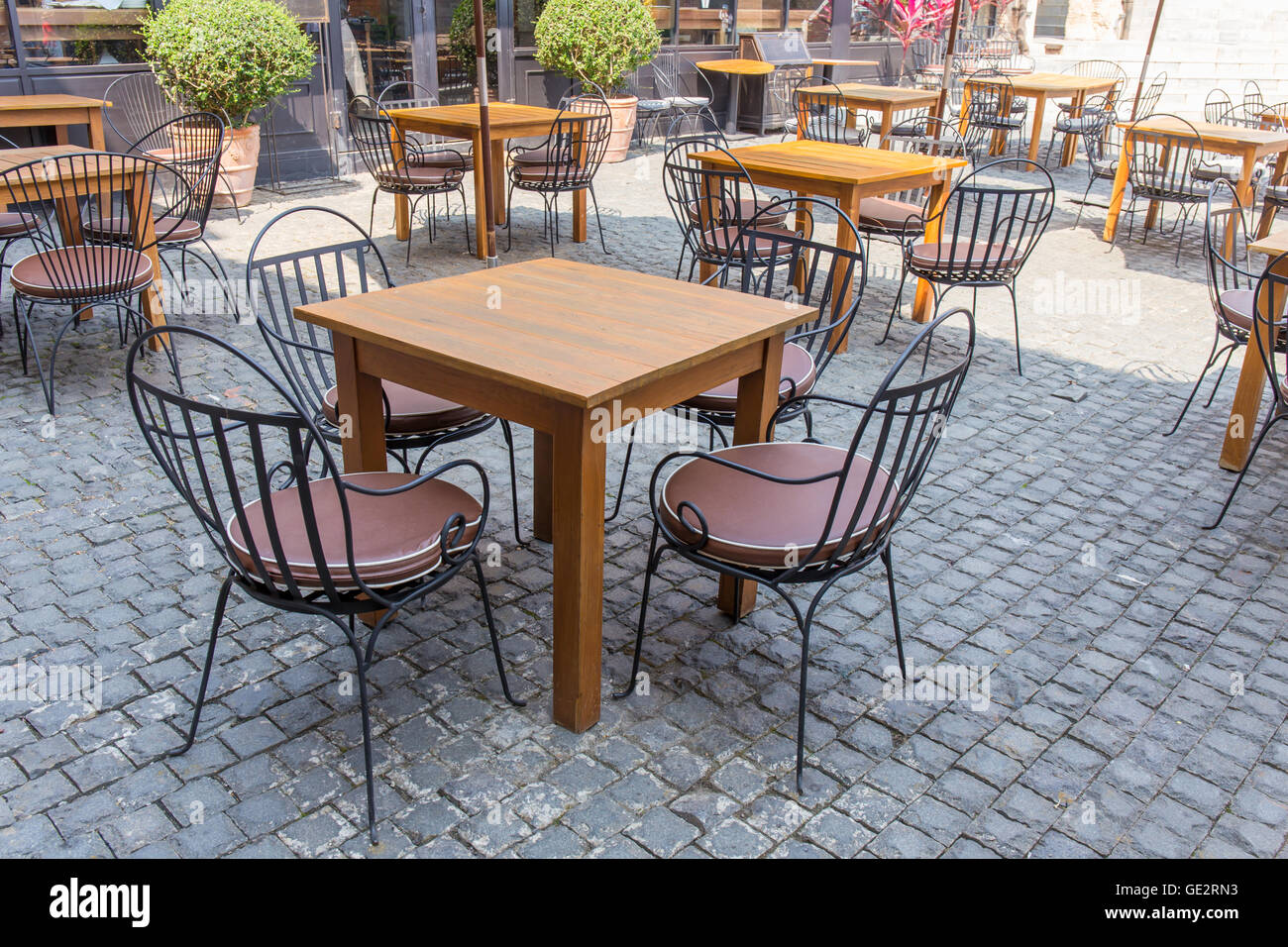 Modern table and chairs set in outdoor Stock Photo - Alamy