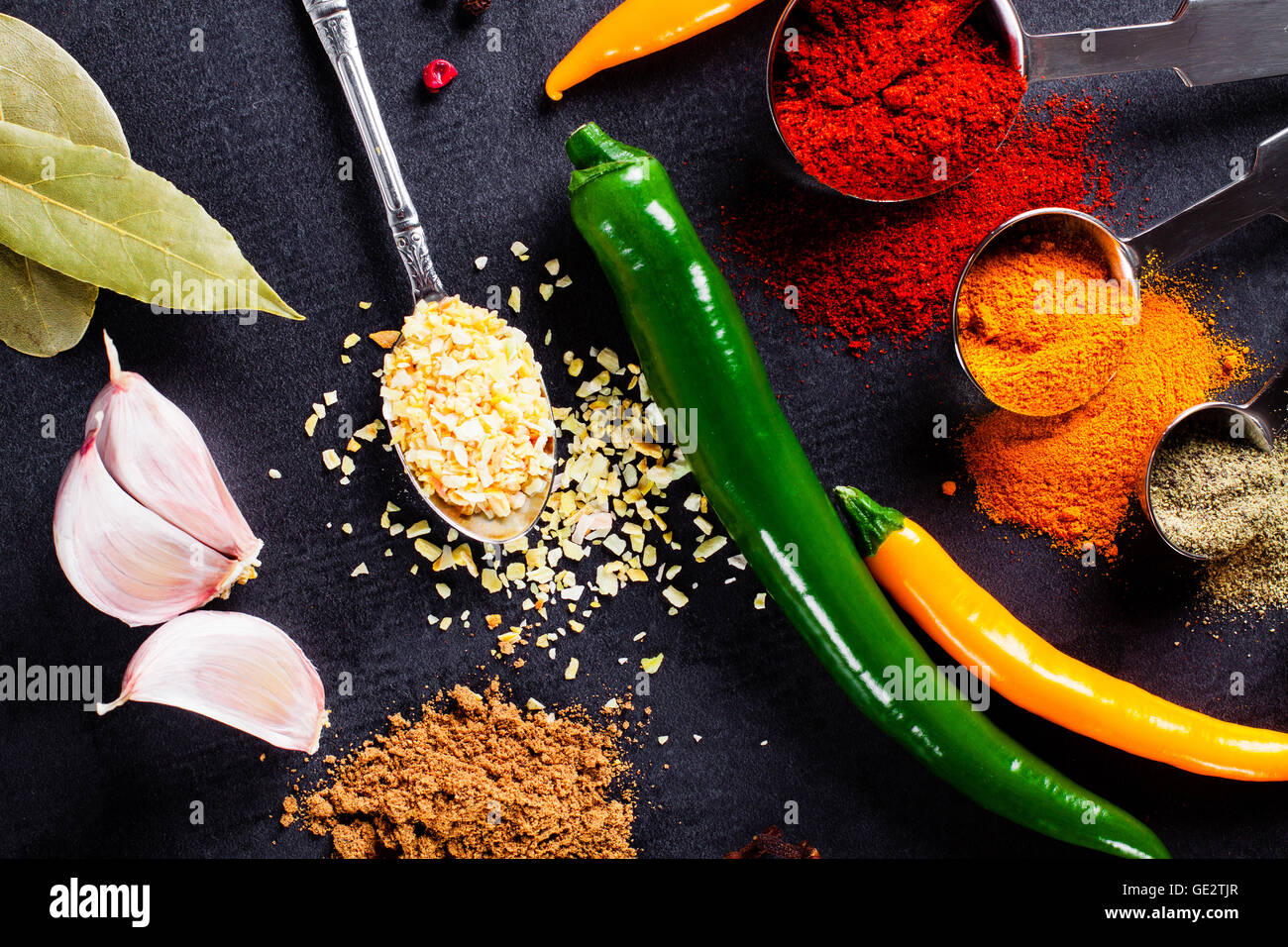 Colored paprika and spices in scoop Stock Photo - Alamy