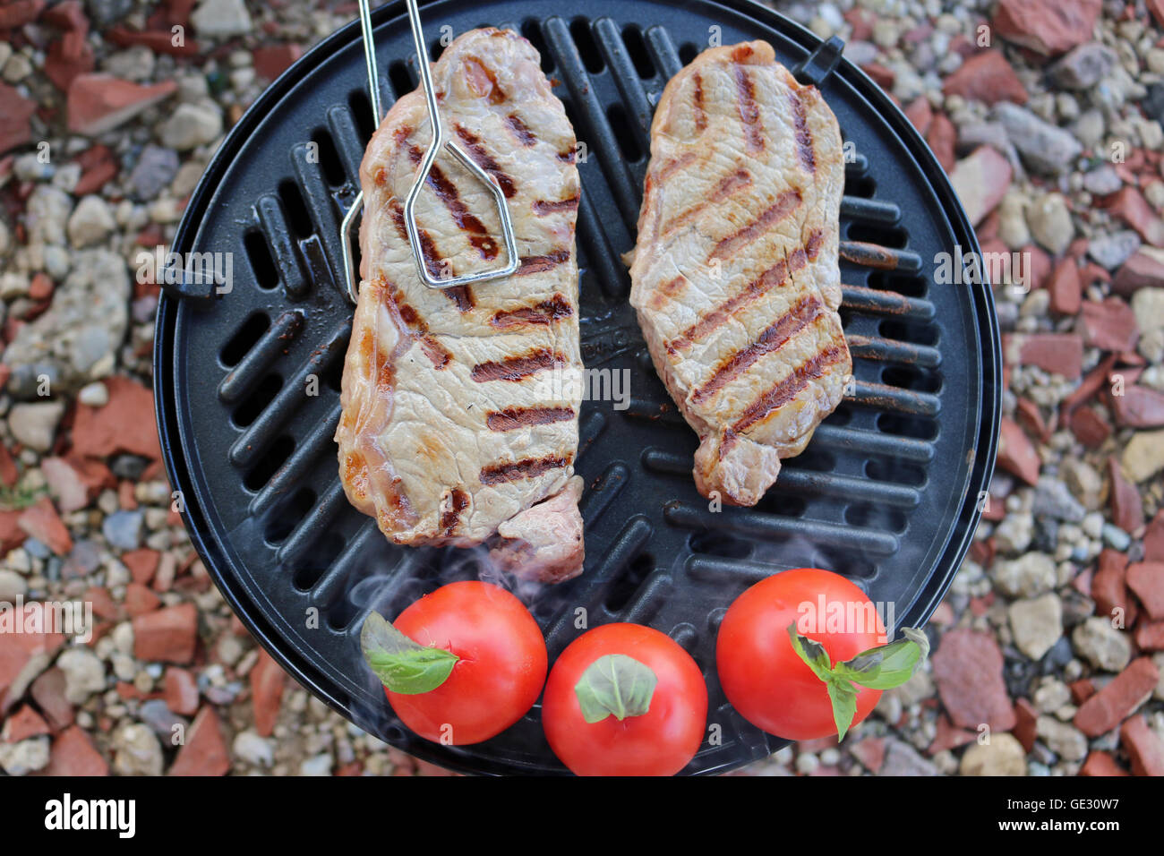 Two steaks on a barbeque Stock Photo - Alamy