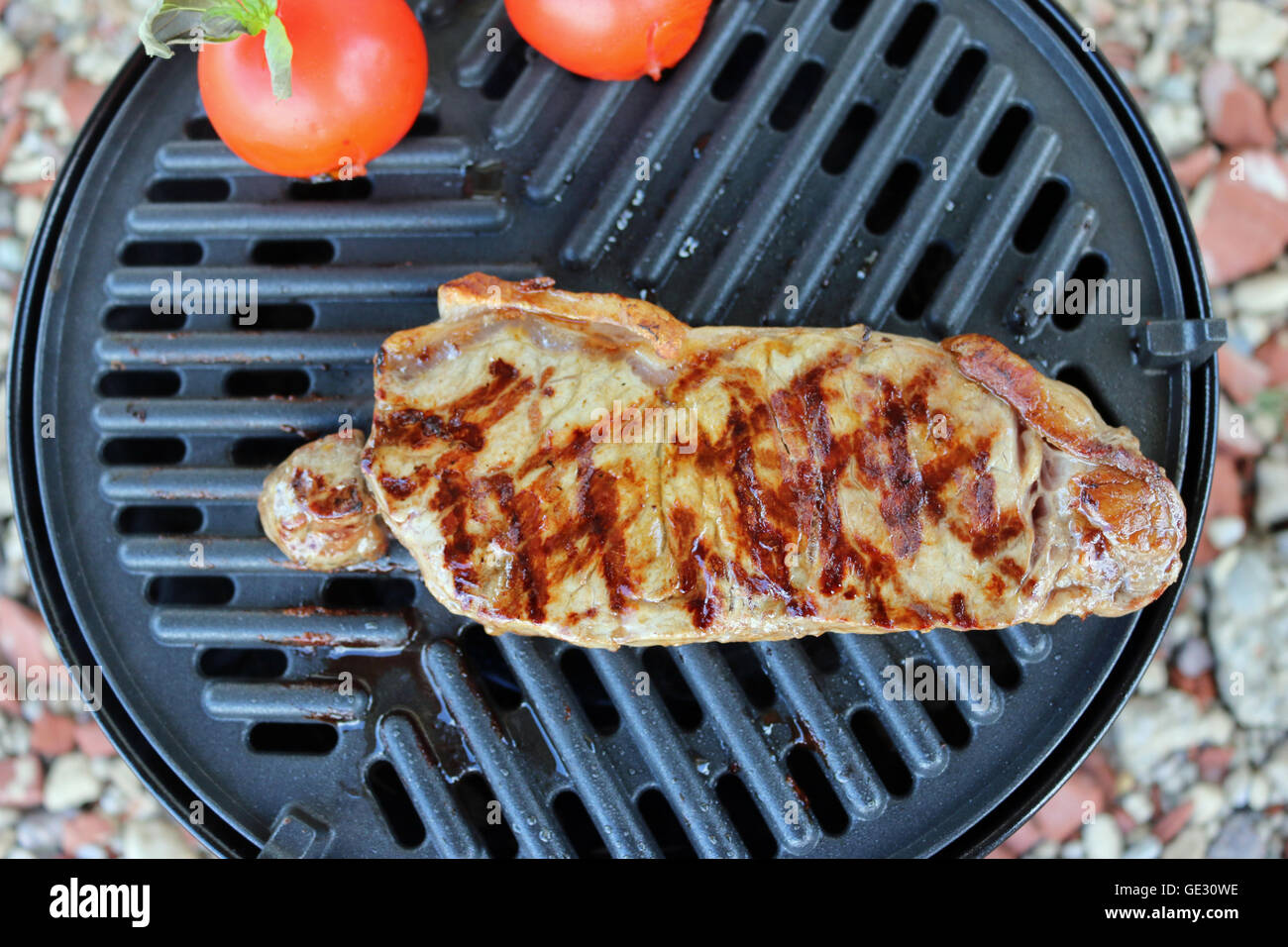 Single steak on a barbeque Stock Photo - Alamy