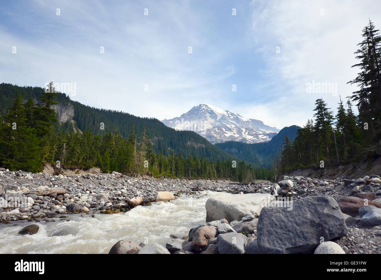 View of rock, river in front of mount rainier national park USA Stock ...